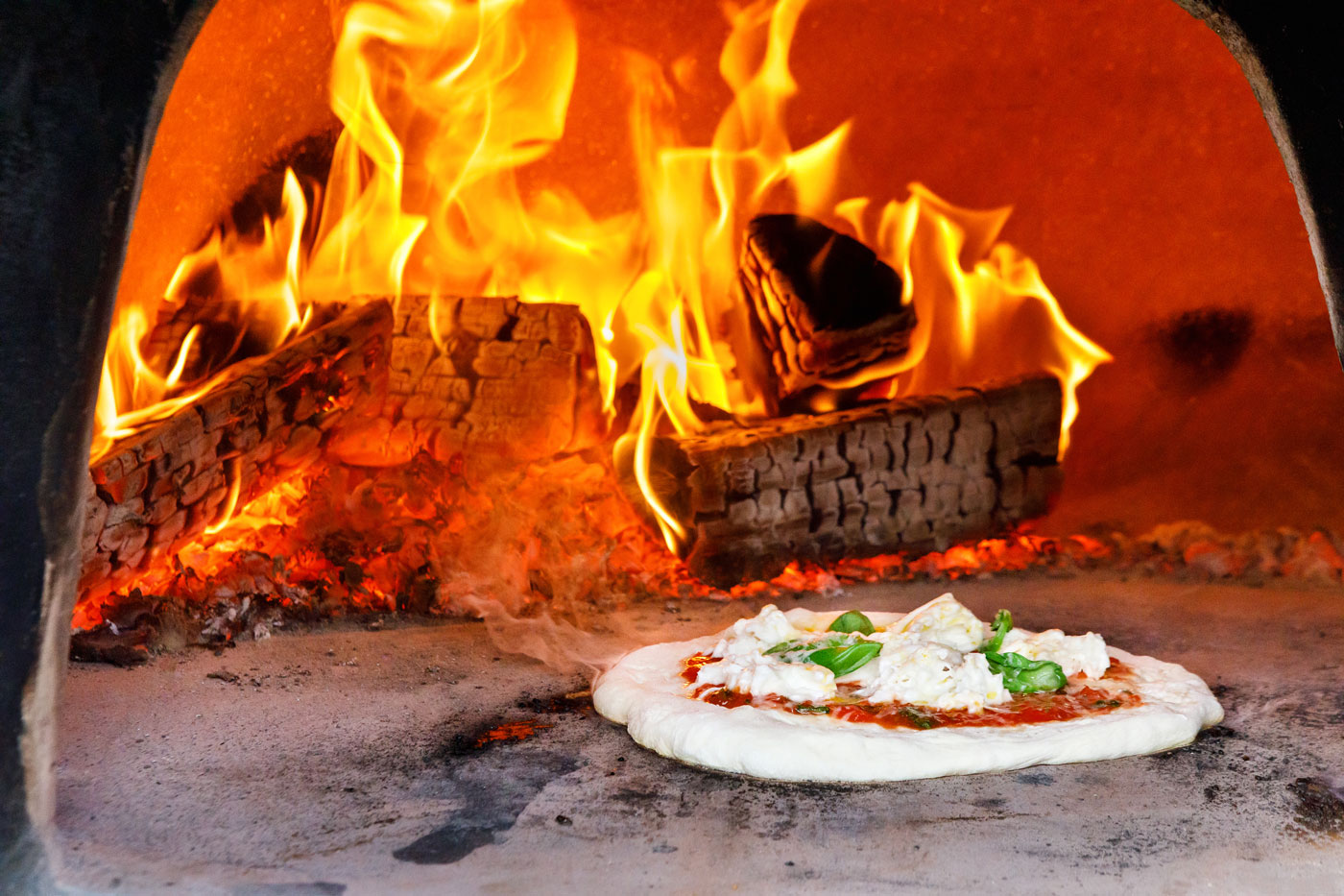 How to Cook Pizza in a Wood Fired Oven